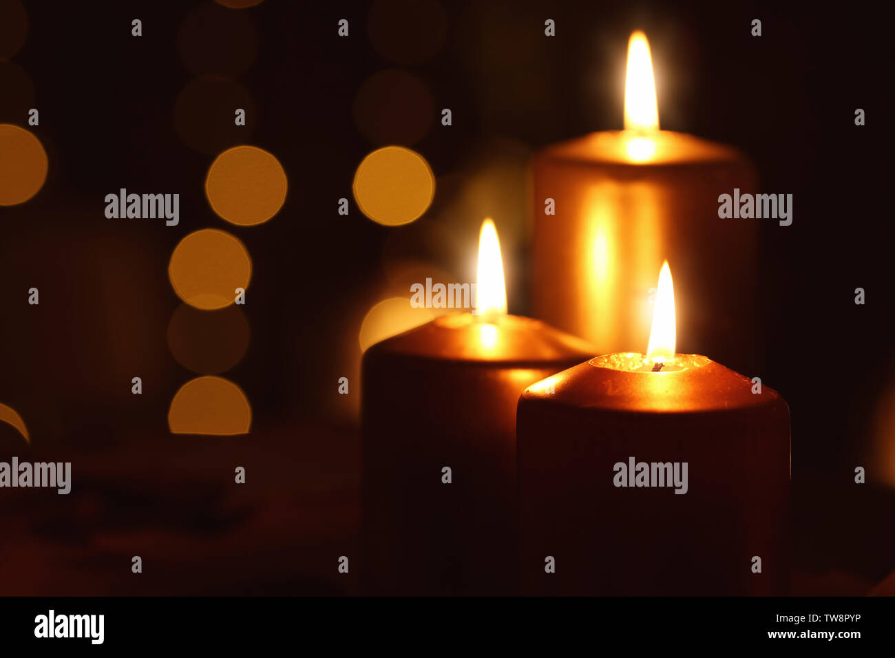 Beautiful candles burning against dark hi-res stock photography and ...