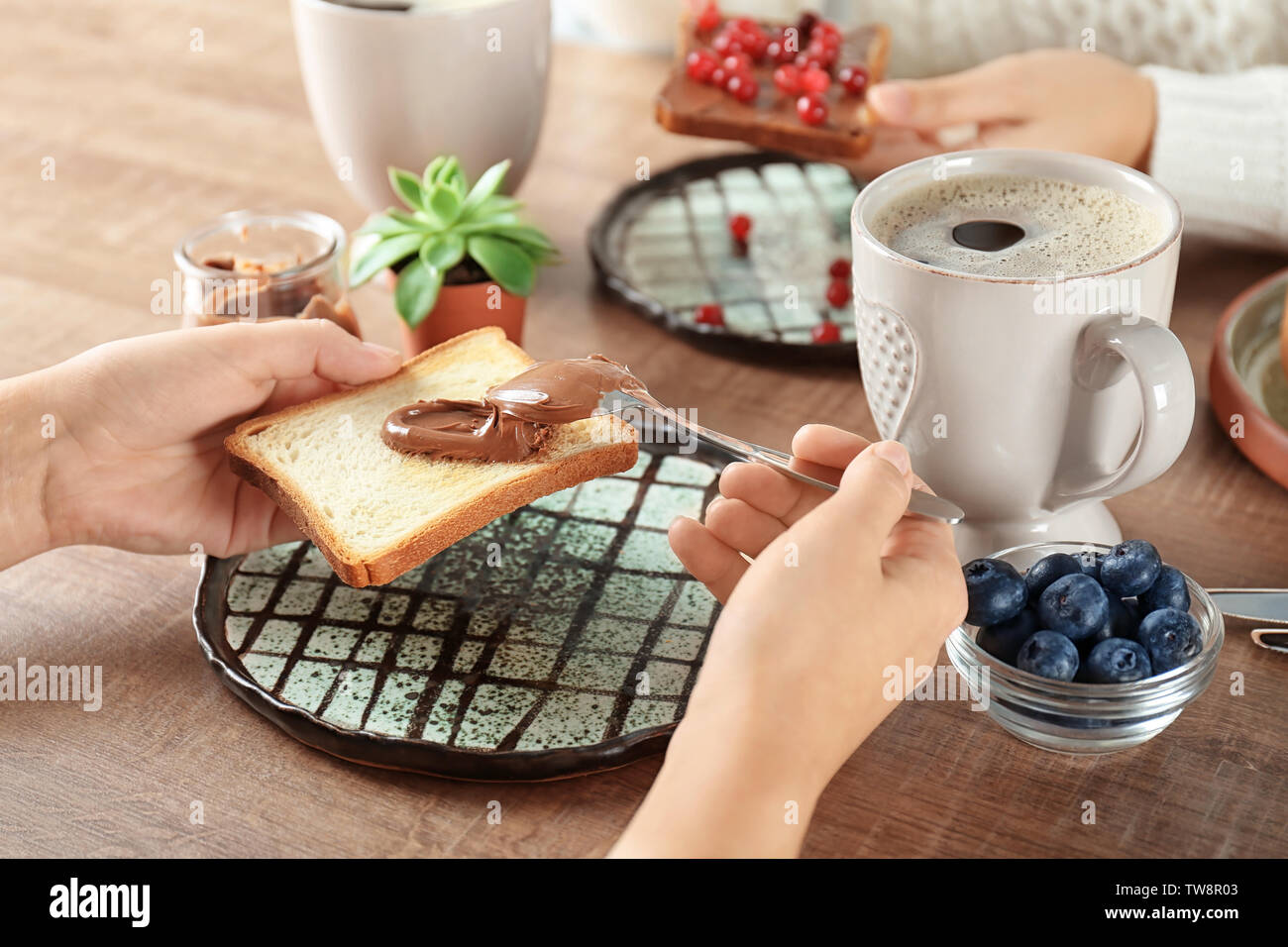 Woman toast chocolate spread hi-res stock photography and images - Alamy