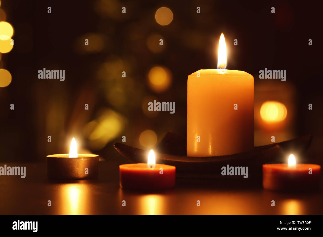 Candles burning in dark against hi-res stock photography and images - Alamy