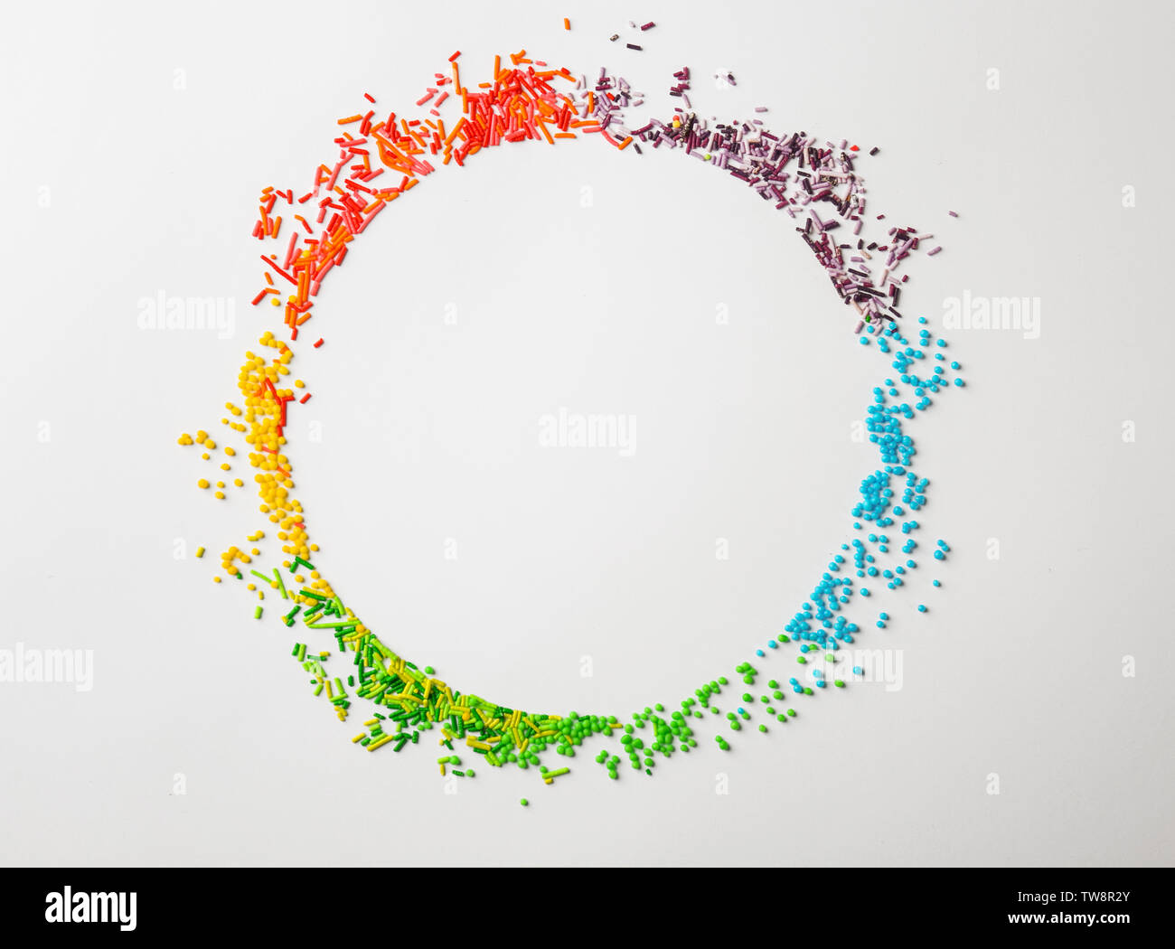 Many rainbow sprinkles in shape of circle on white background Stock ...