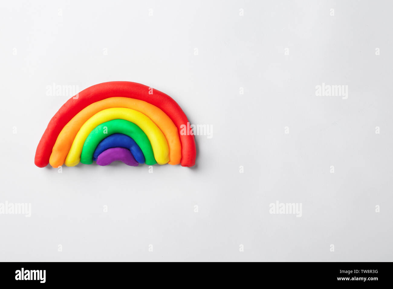 Plasticine rainbow on white background Stock Photo - Alamy