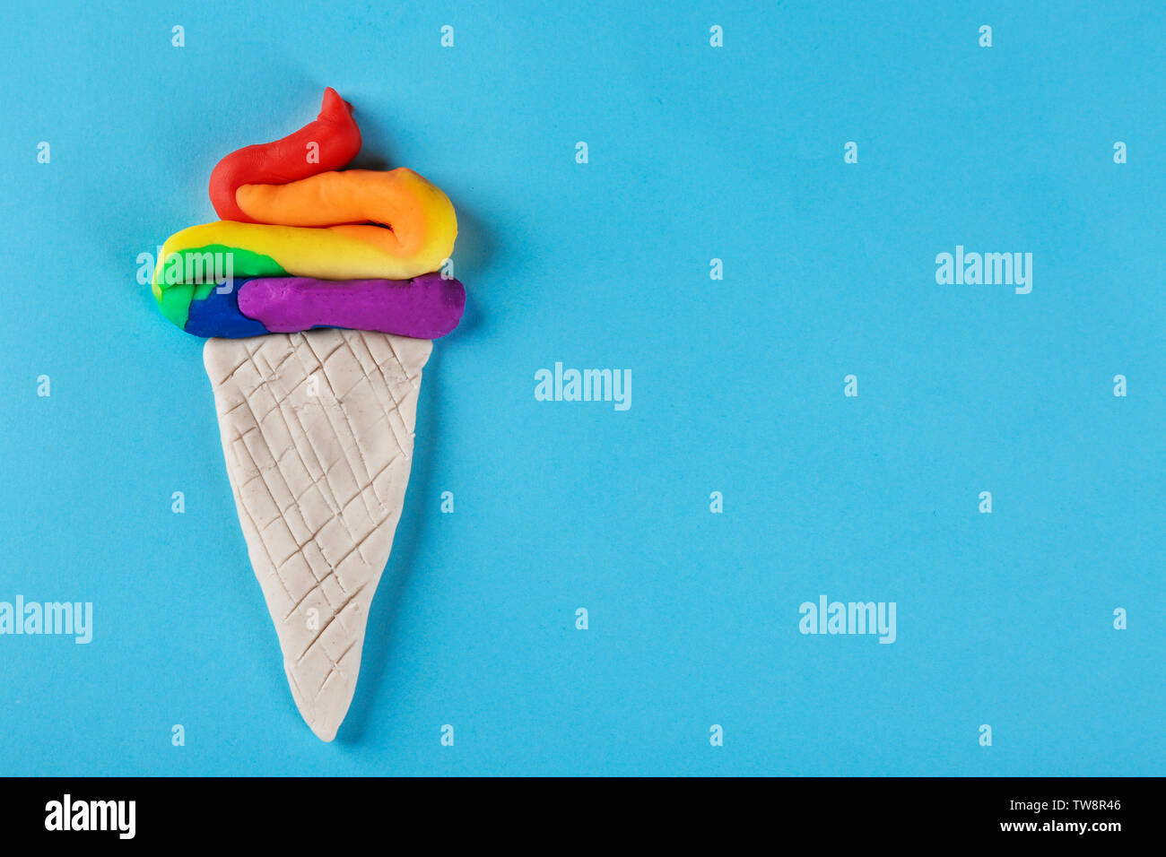 Rainbow ice cream made from play dough on color background Stock Photo ...