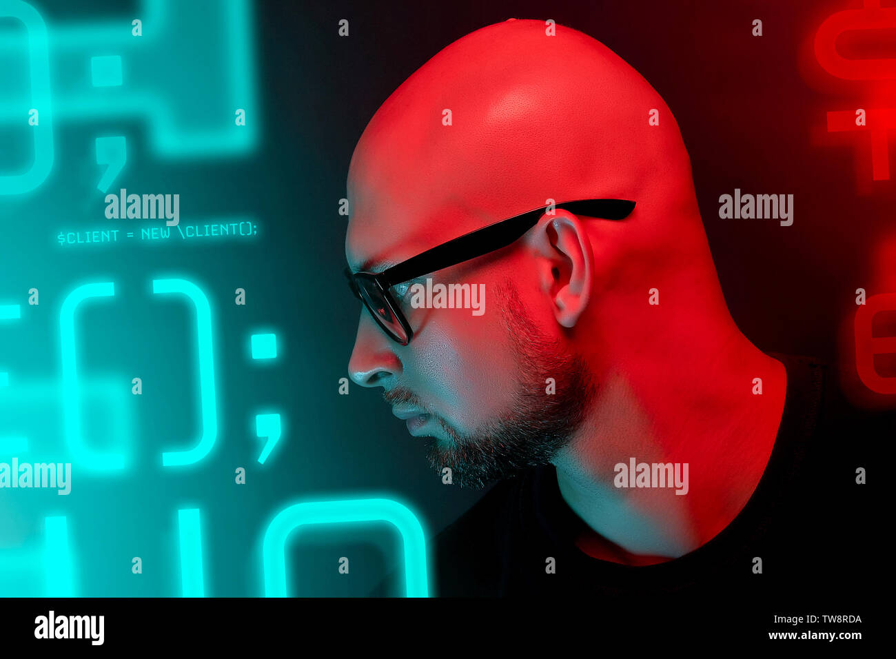 Attractive bald man with beard in glasses on black neon light ...