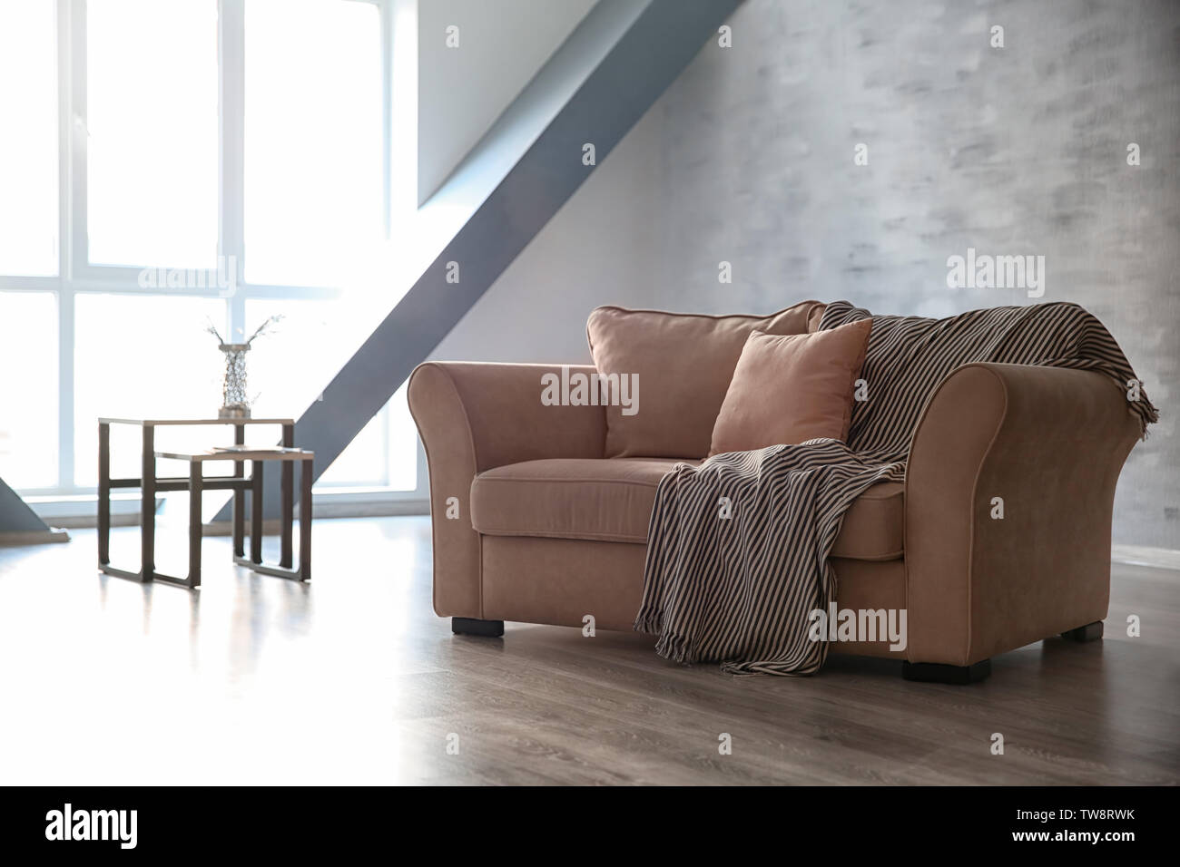 Interior of living room with comfortable sofa Stock Photo - Alamy