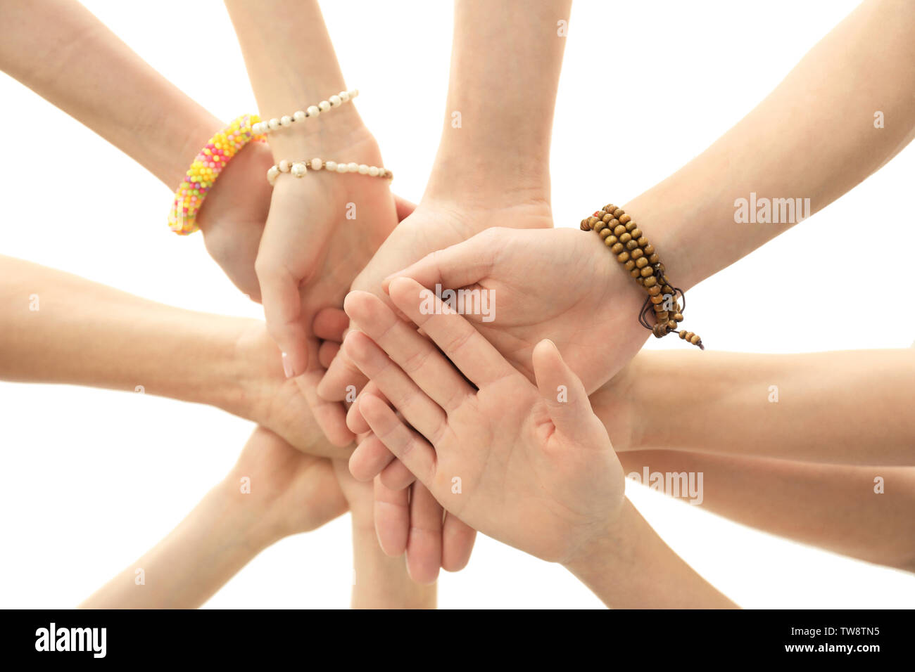 People putting hands together as symbol of unity Stock Photo - Alamy