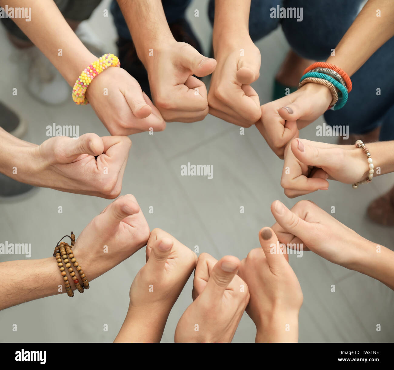 People putting hands together as symbol of unity Stock Photo - Alamy