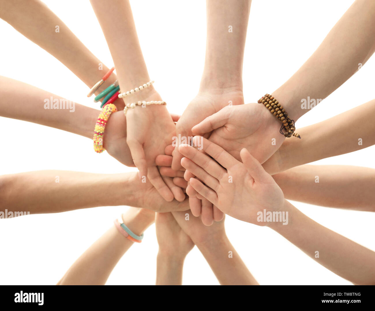 People putting hands together as symbol of unity Stock Photo - Alamy
