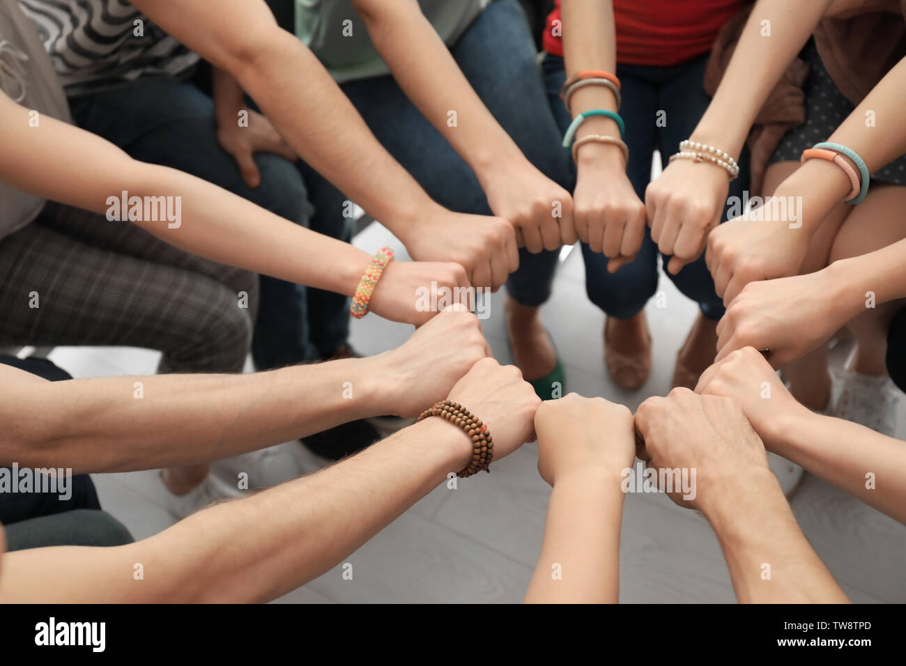 People putting hands together as symbol of unity Stock Photo - Alamy