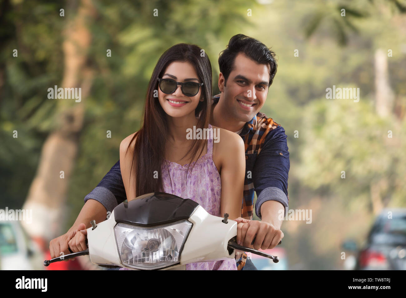 Two people riding a motorbike hi-res stock photography and images - Alamy