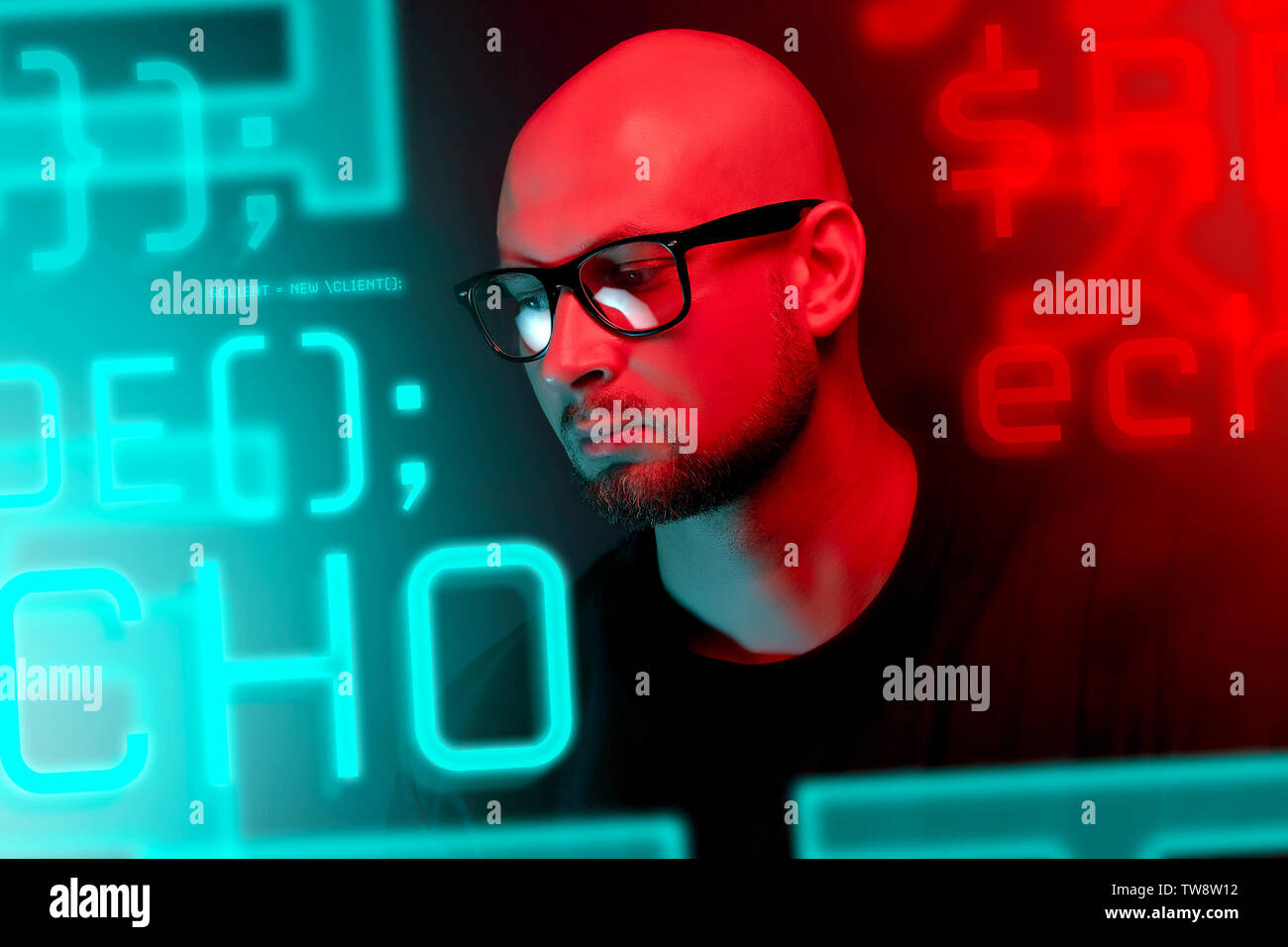 Attractive bald man with beard in glasses on black neon light ...