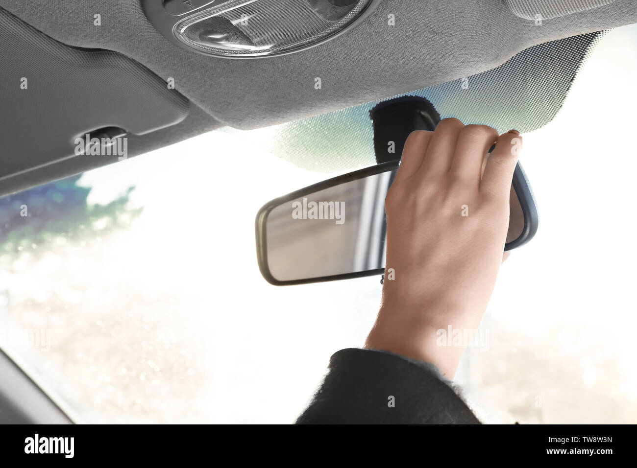 Woman adjusting car mirror hi-res stock photography and images - Alamy