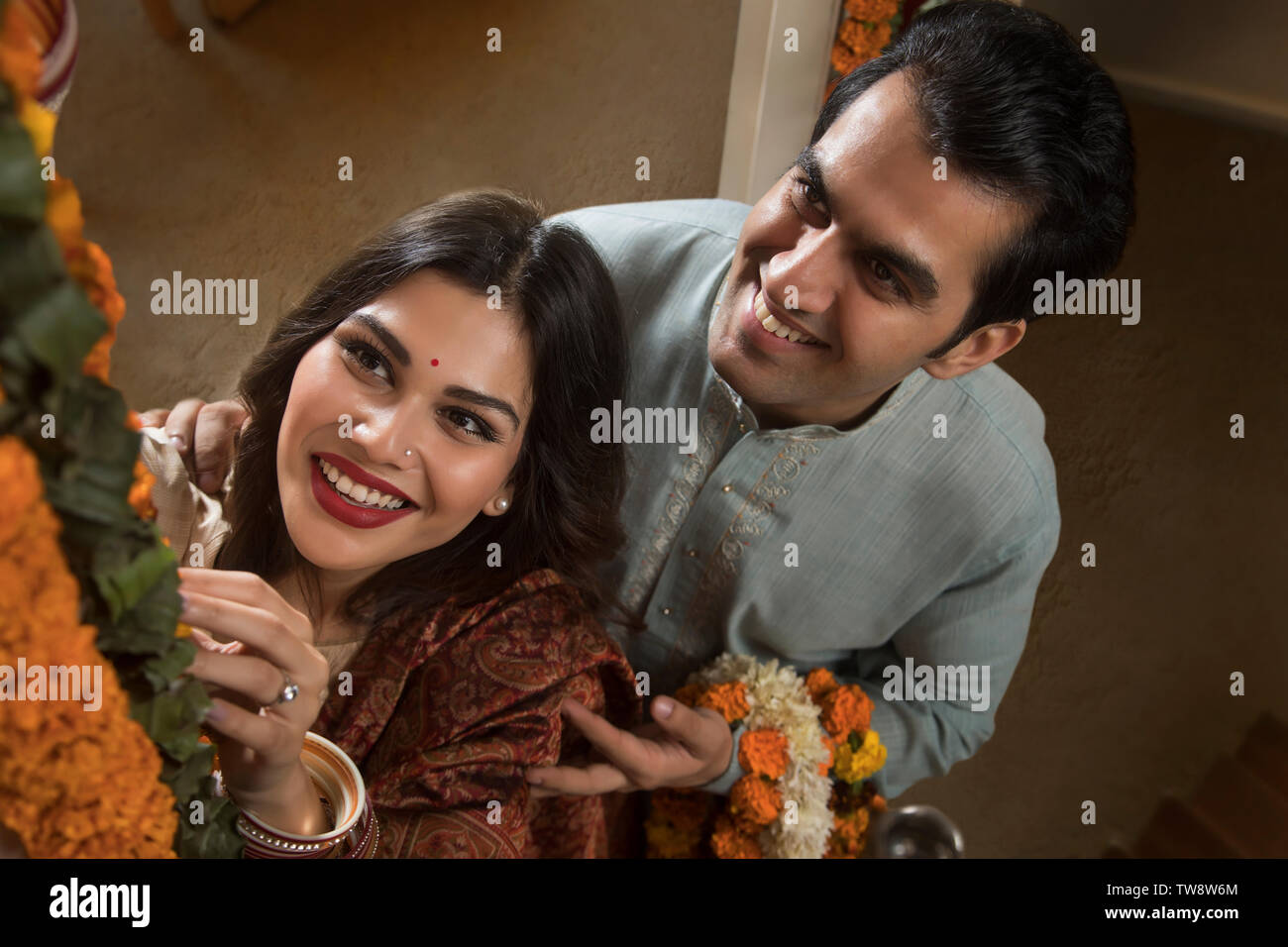 Young couple newlywed in traditional dress performing rituals Stock ...