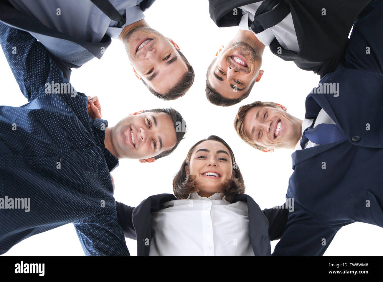 People standing together against white background, view from below ...