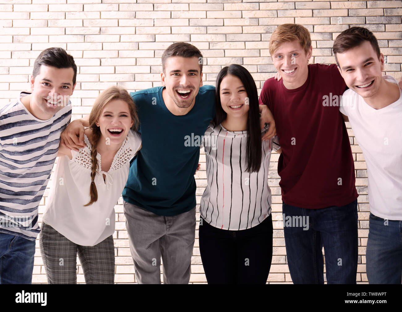 People standing together indoors. Unity concept Stock Photo - Alamy