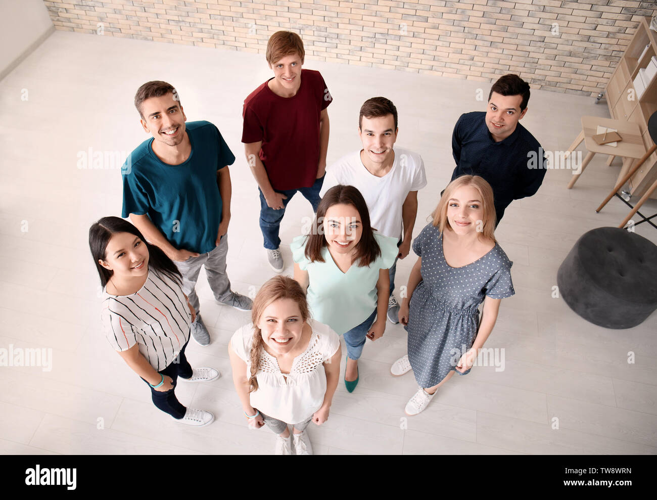 People standing together indoors. Unity concept Stock Photo - Alamy