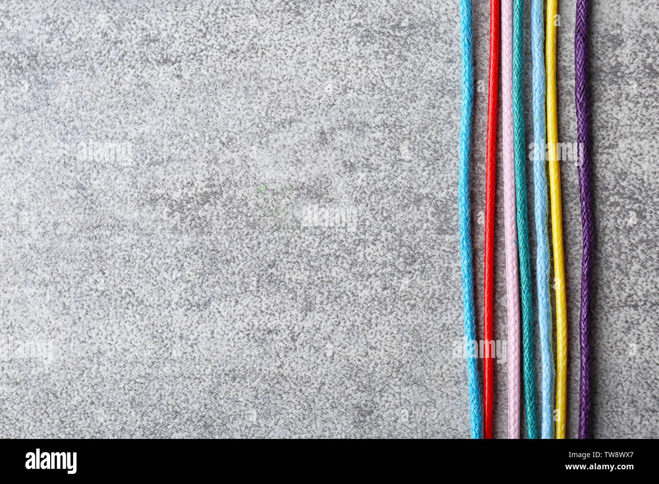 Color strings on grey background. Unity concept Stock Photo - Alamy