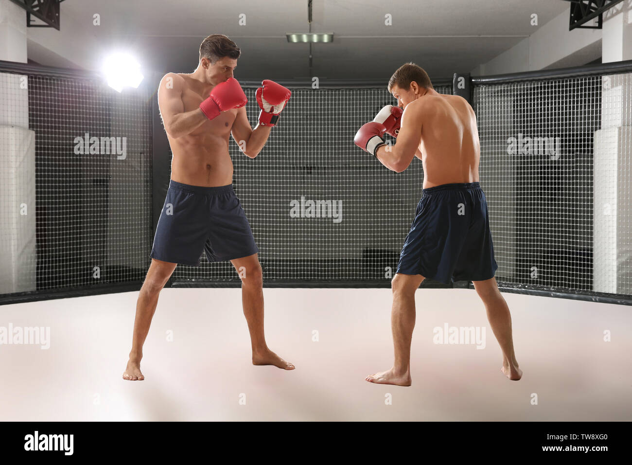 Two strong boxers fighting in gym Stock Photo - Alamy