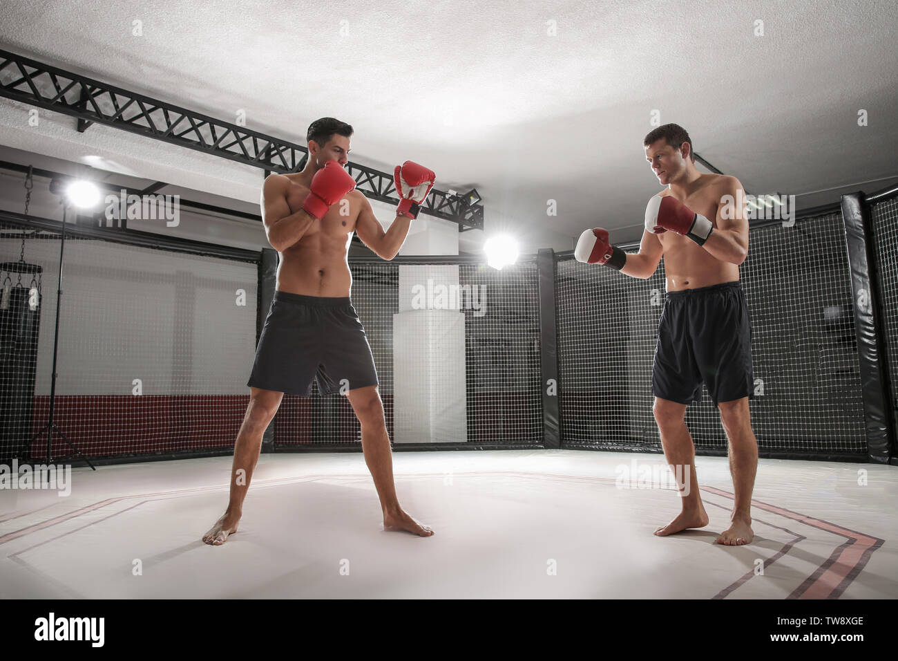 Two strong boxers fighting in gym Stock Photo - Alamy