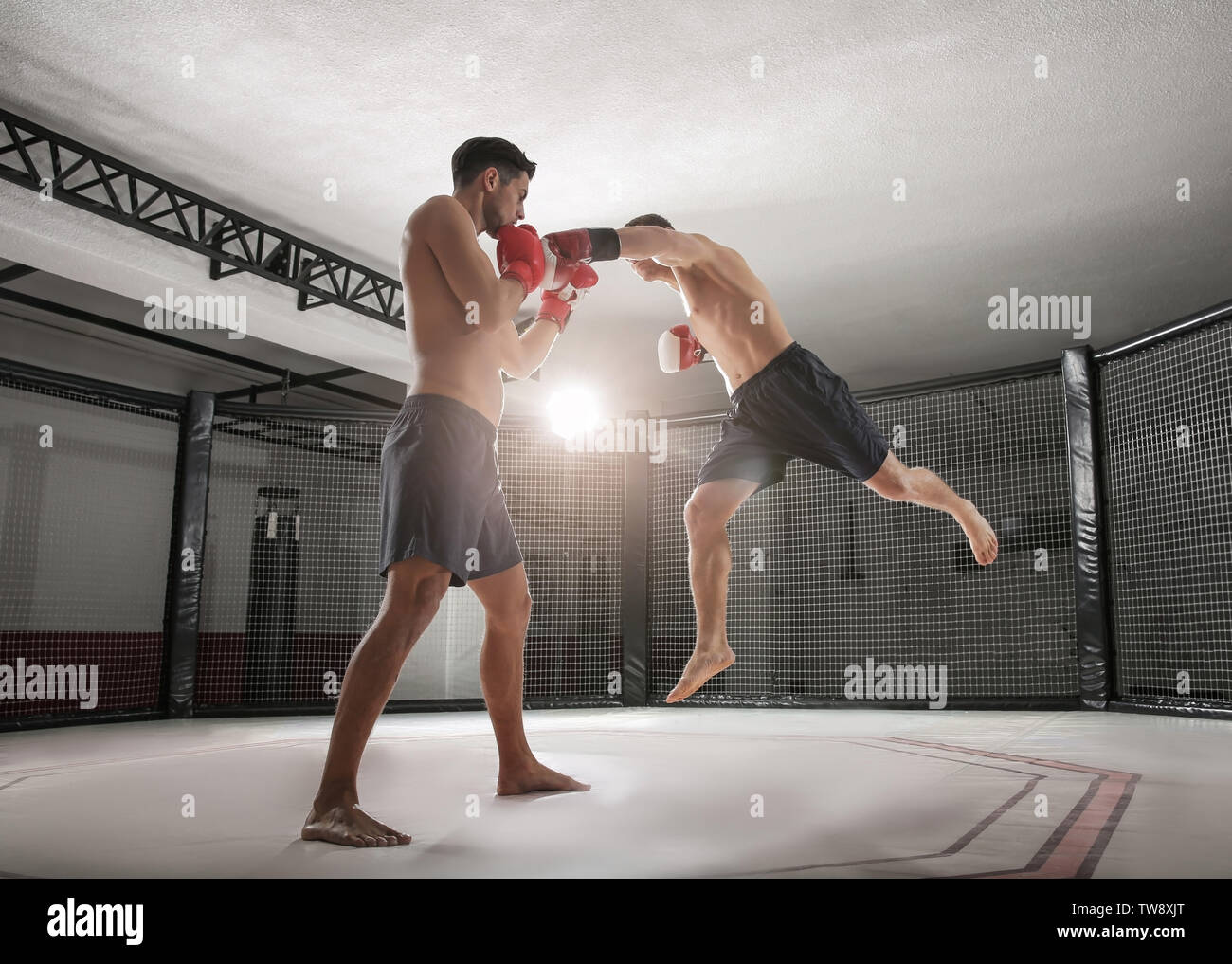 Two strong kickboxers fighting in gym Stock Photo - Alamy
