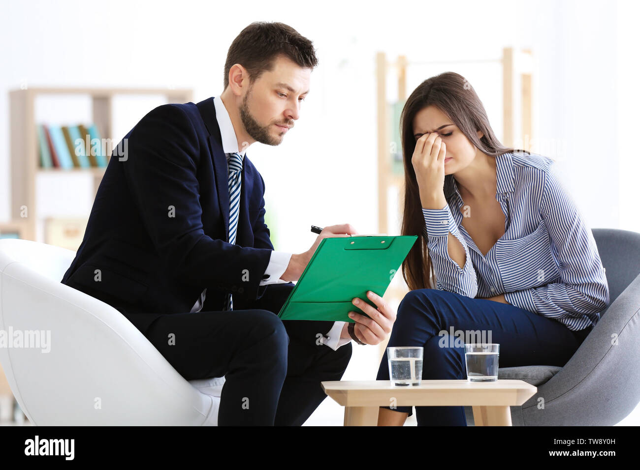 Male psychologist with patient in office Stock Photo - Alamy