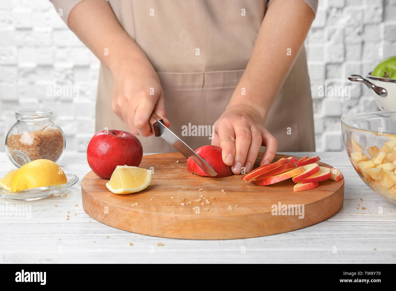 Person cutting apple apron hi-res stock photography and images - Alamy