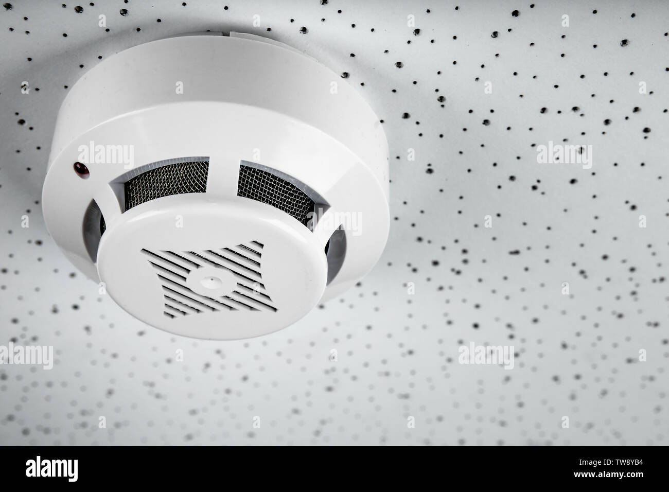 Smoke detector on light background Stock Photo - Alamy