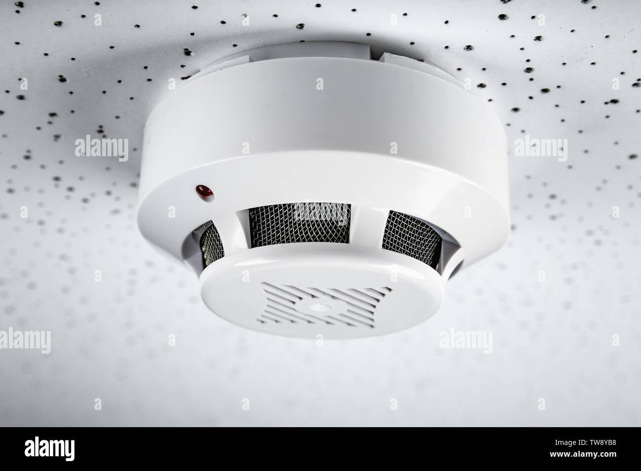 Smoke detector on light background Stock Photo - Alamy