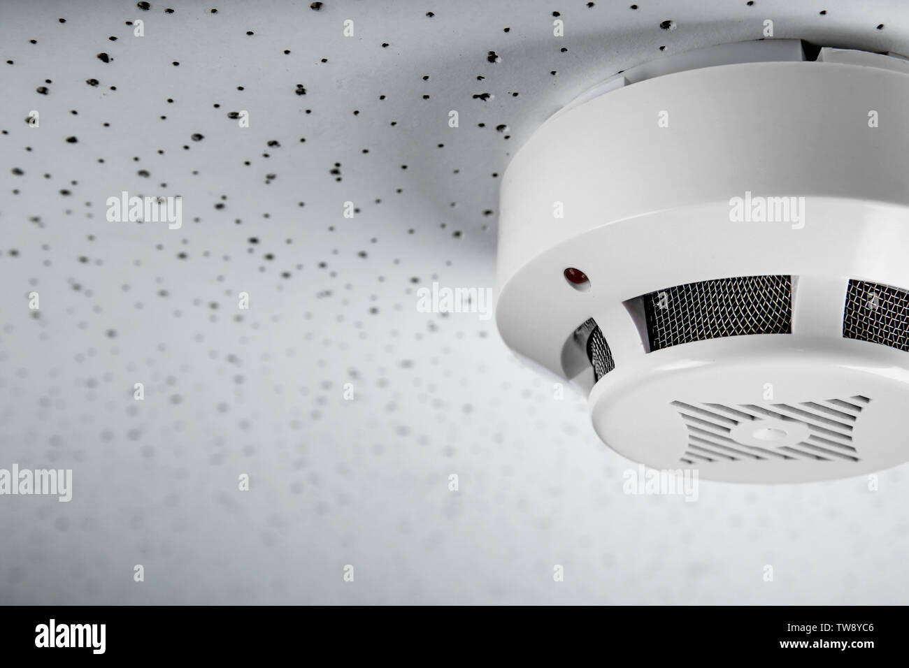 Smoke detector on light background Stock Photo - Alamy