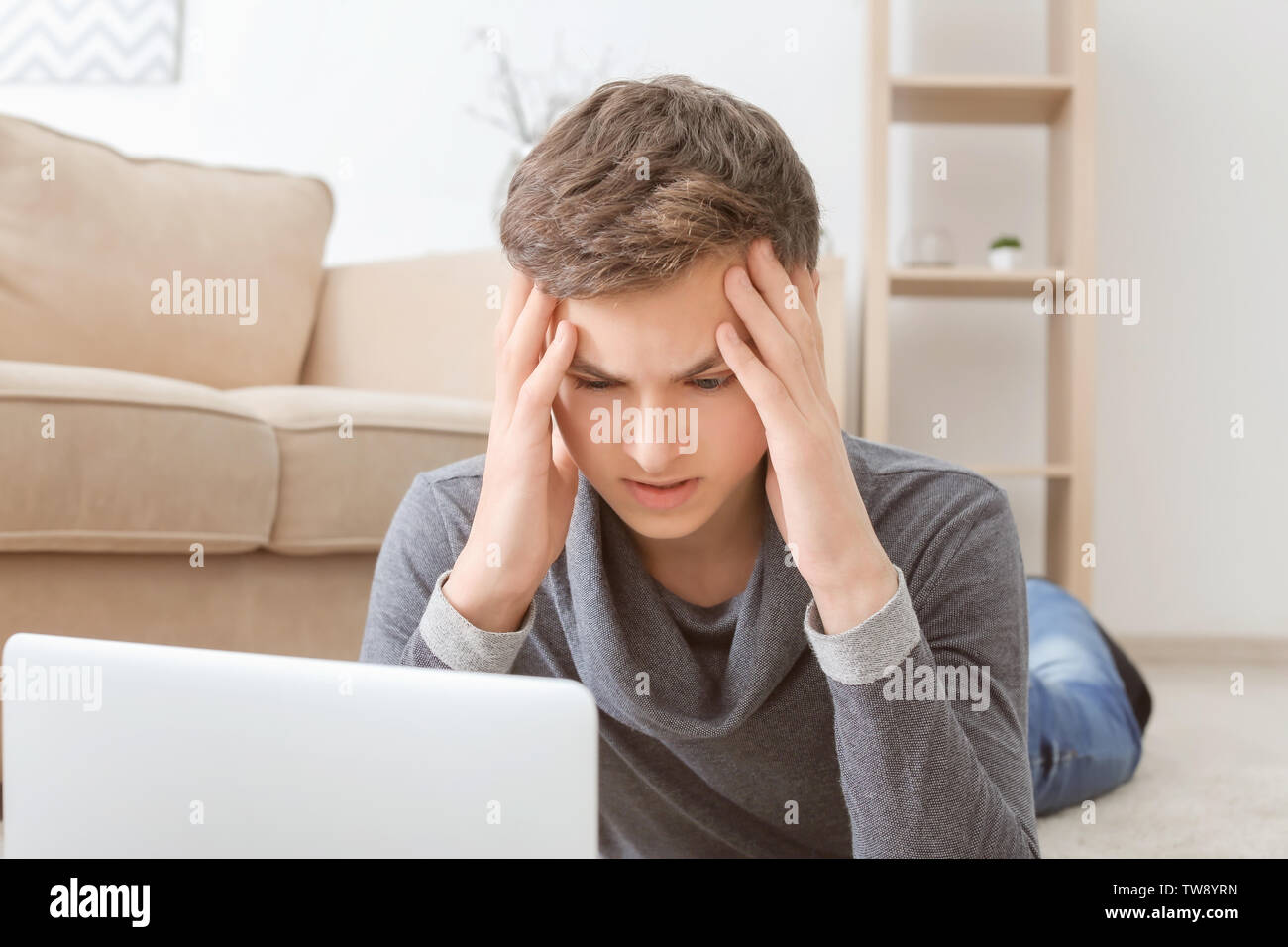 Depressed teen laptop hi-res stock photography and images - Alamy
