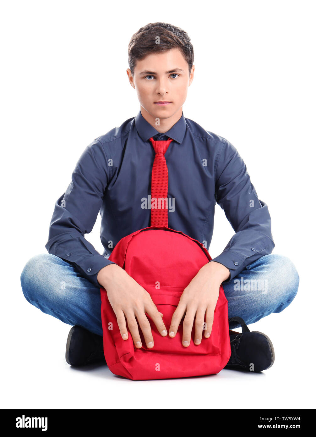Stylish teenager with backpack against white background Stock Photo - Alamy
