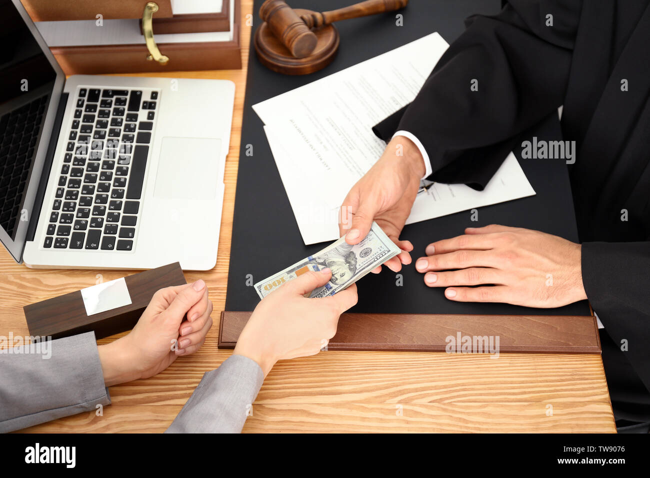 Male judge taking bribe from woman, closeup Stock Photo - Alamy