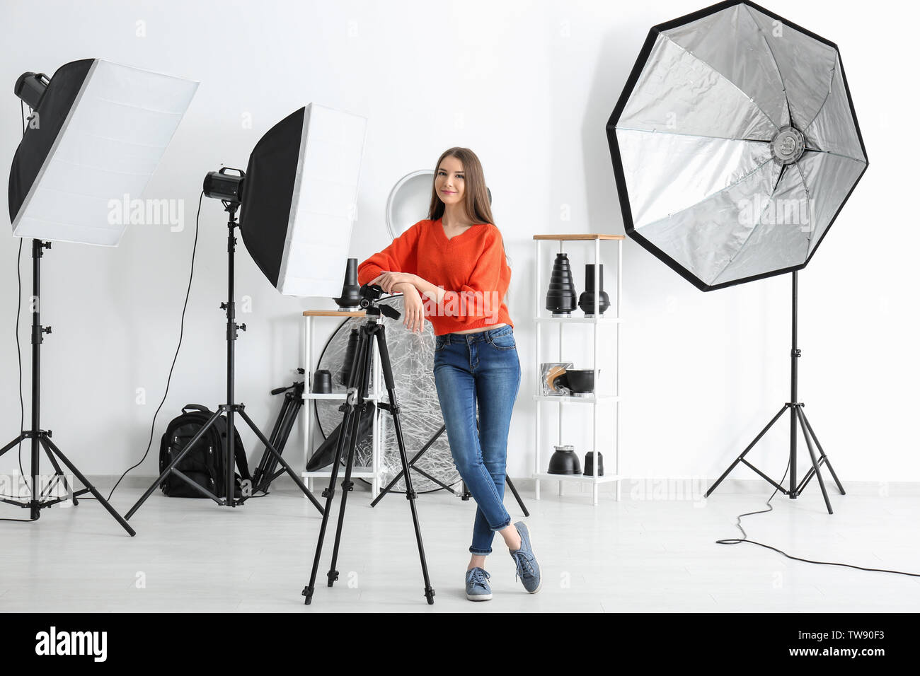 Young female photographer in studio Stock Photo - Alamy