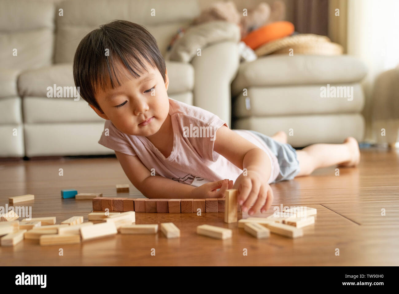 Girl with blocks on floor hi-res stock photography and images - Alamy