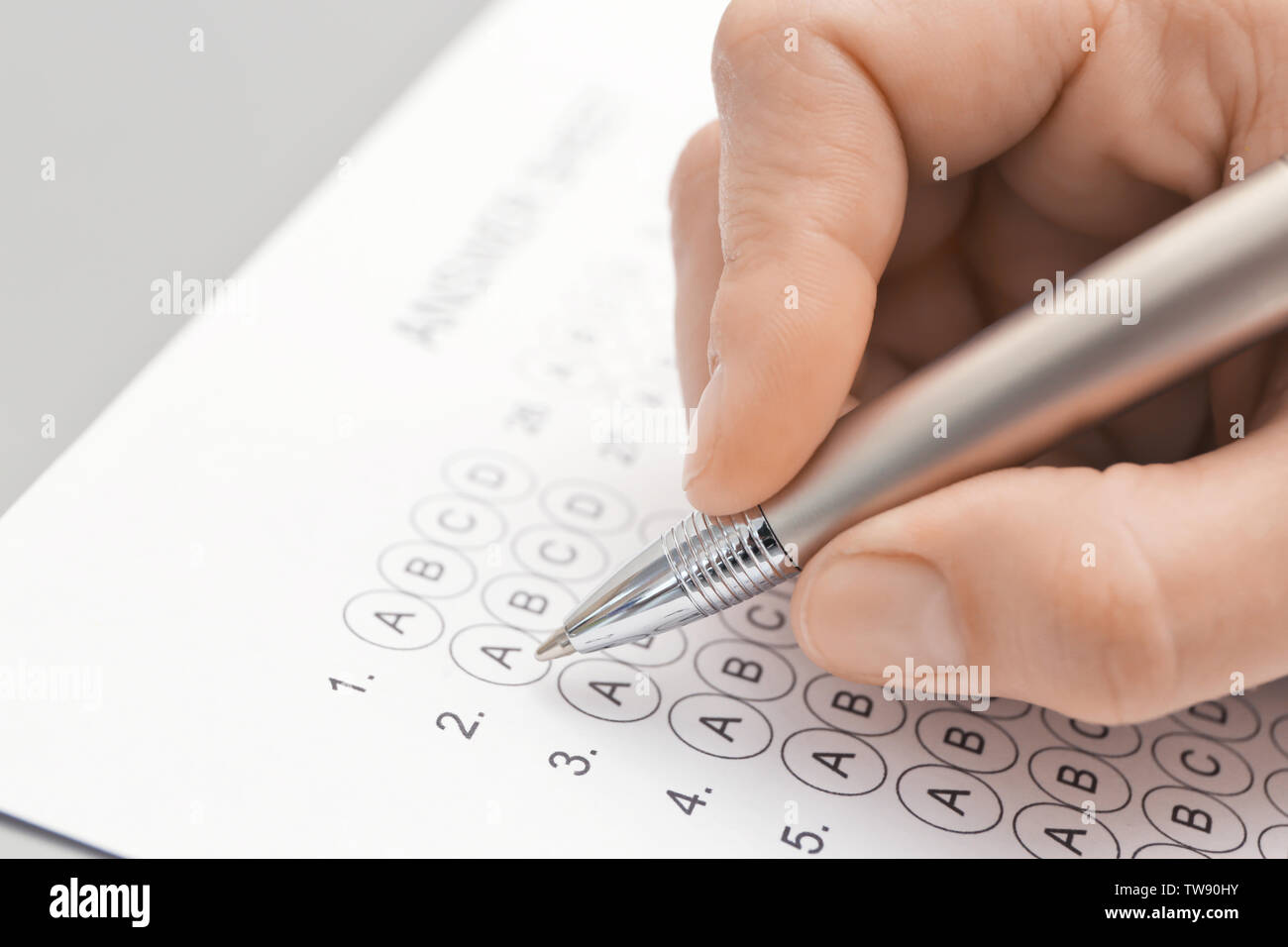 Male student passing exam, closeup Stock Photo - Alamy