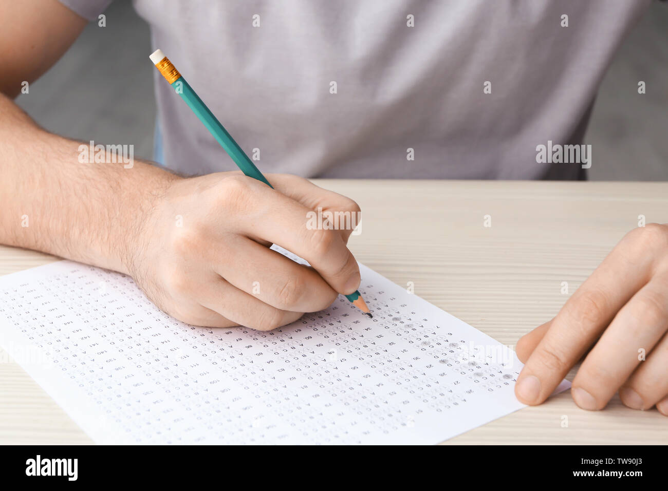 Male student passing exam, closeup Stock Photo - Alamy