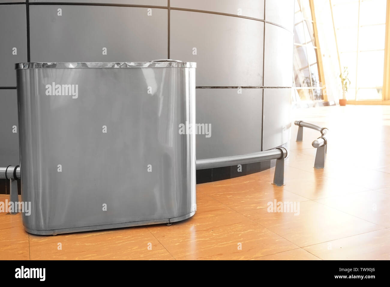 Metal trash bin indoors. Recycling concept Stock Photo - Alamy
