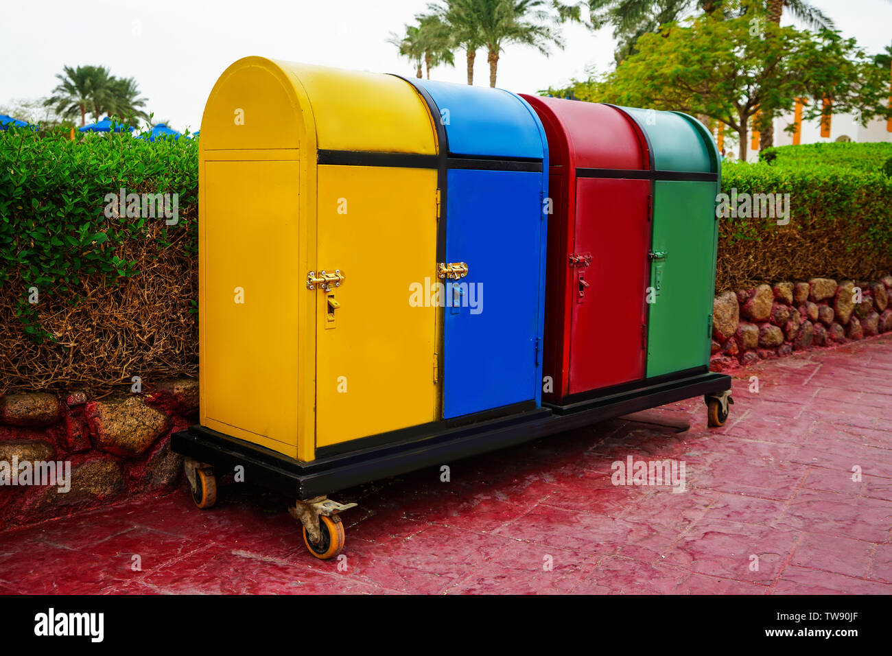 Different colorful trash bins outdoors. Recycling concept Stock Photo ...