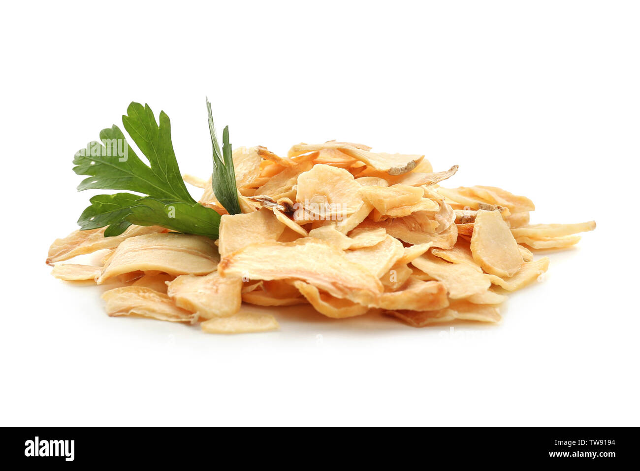Dried garlic flakes on white background Stock Photo - Alamy