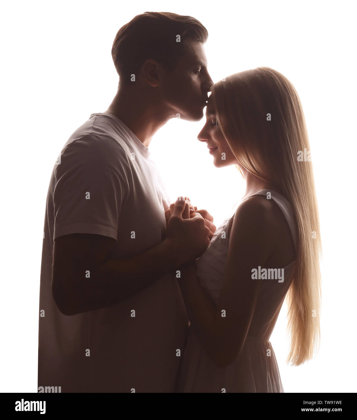 Romantic couple in circle of light on black background Stock Photo - Alamy