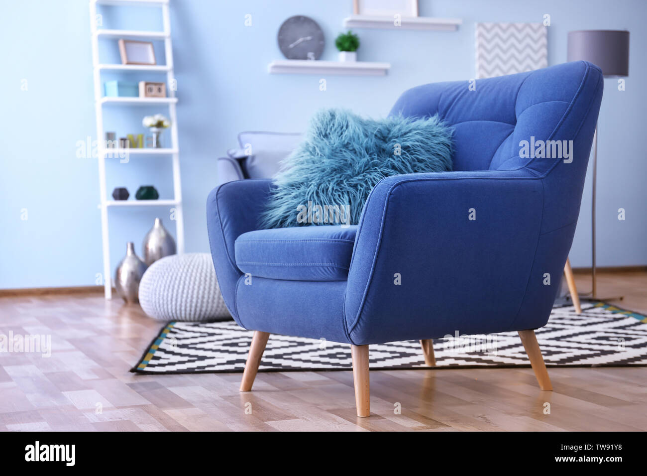 Interior of living room with comfortable armchair Stock Photo - Alamy