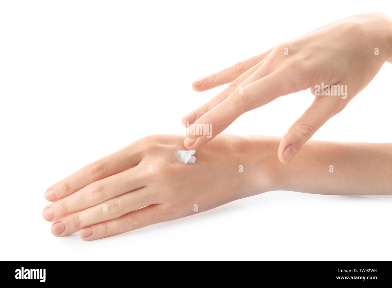 Young woman applying hand cream on white background Stock Photo - Alamy