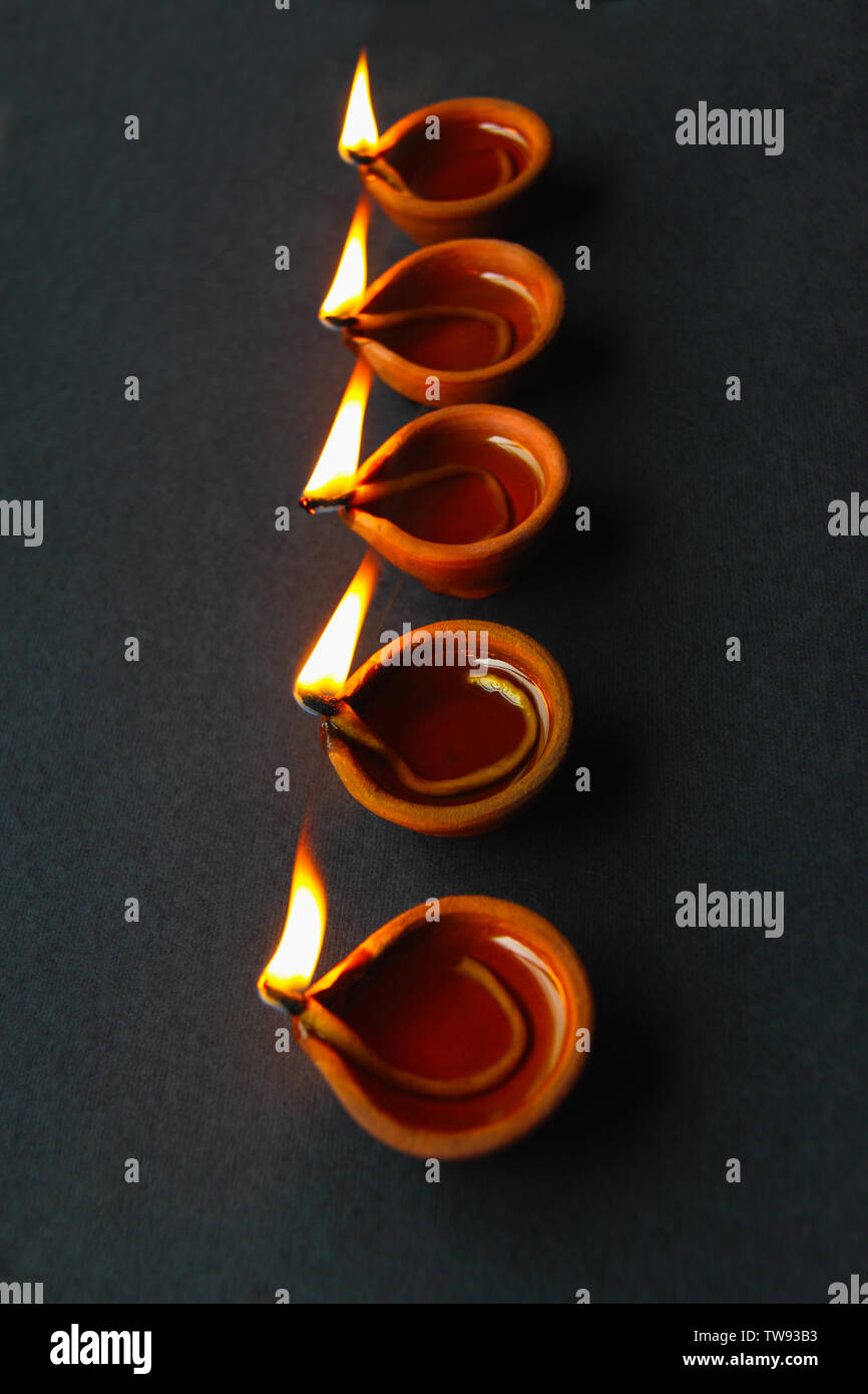 Diya in a row hi-res stock photography and images - Alamy