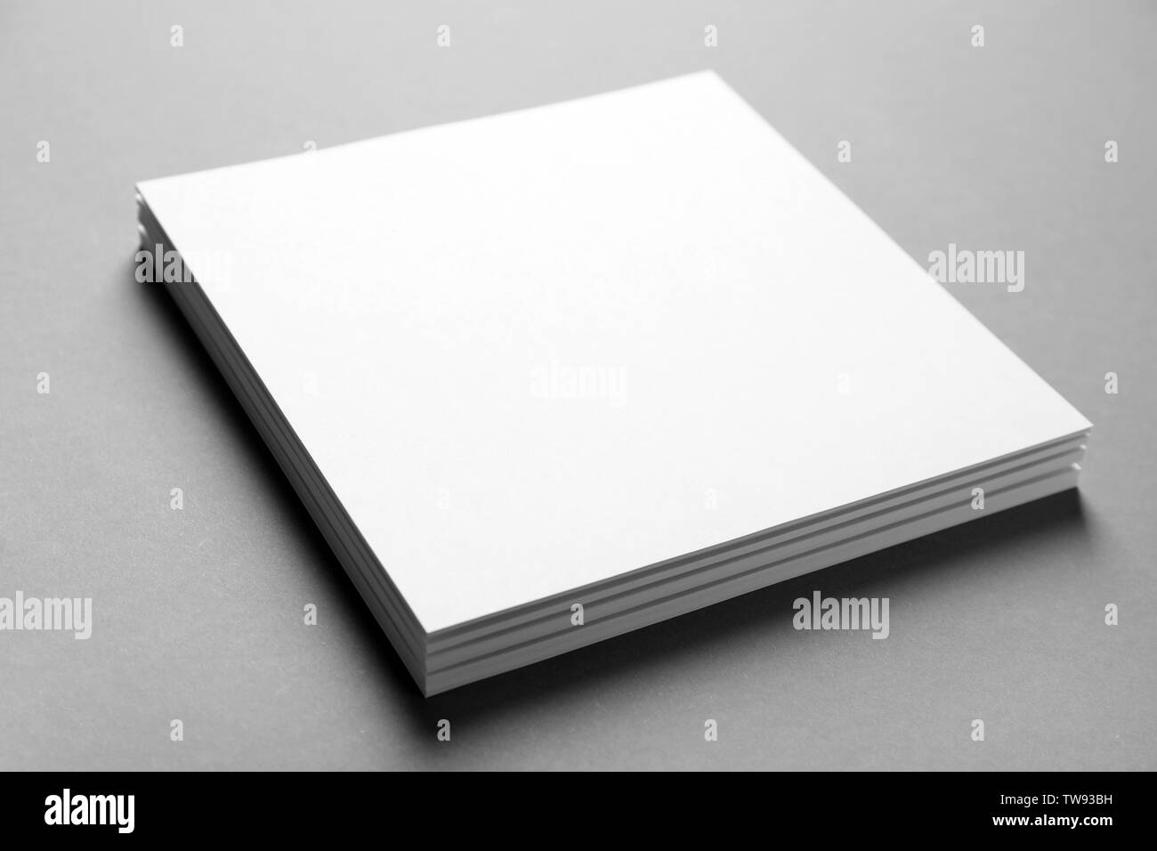 Blank sheets of paper on grey background. Mock up for design Stock ...