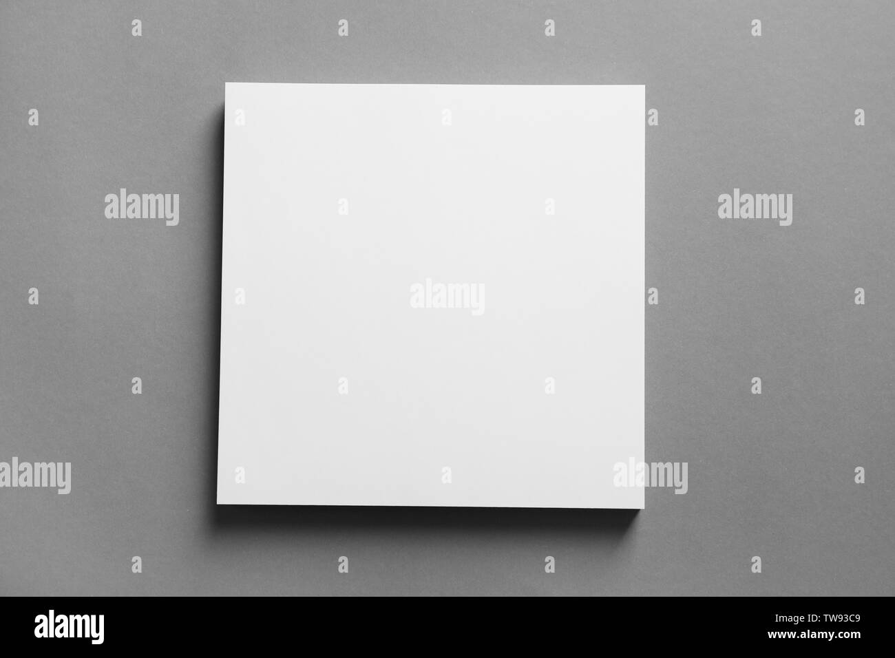 Blank sheet of paper on grey background. Mock up for design Stock Photo ...
