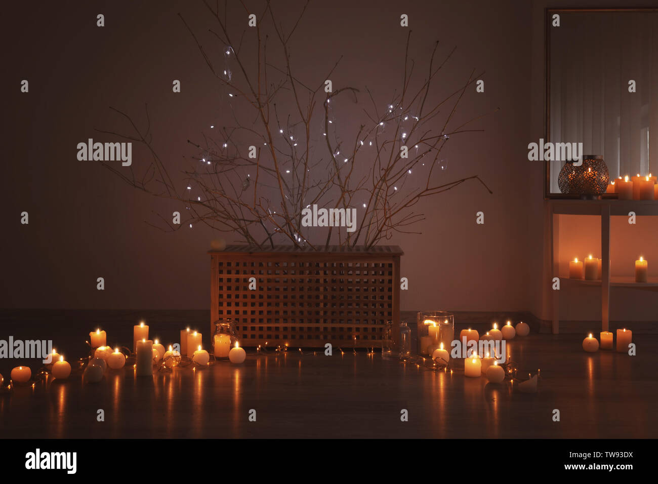 Burning candles as decor in room interior Stock Photo - Alamy