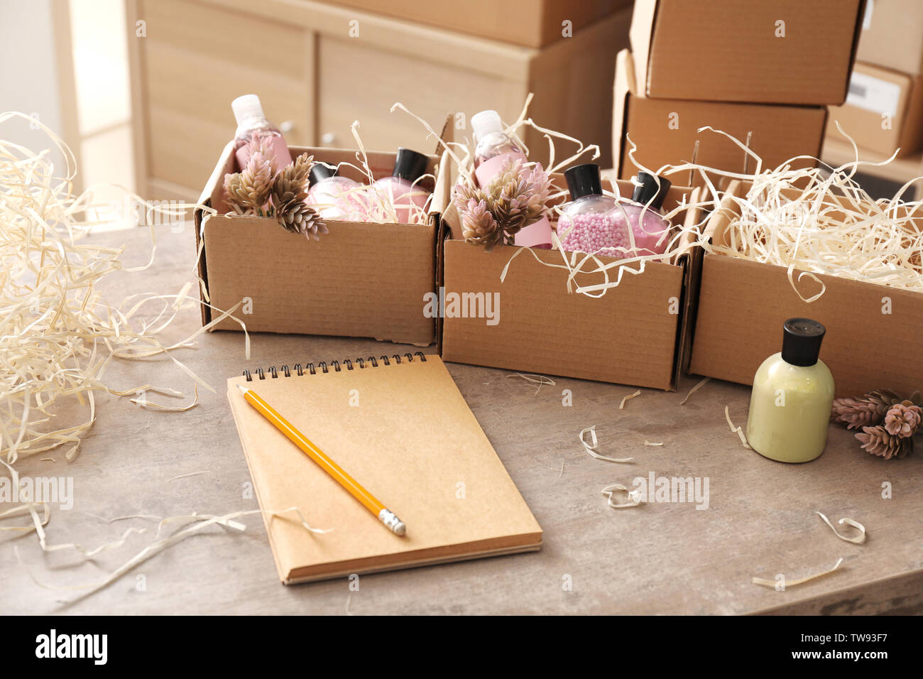 Preparing parcels for shipment to customer on table Stock Photo - Alamy