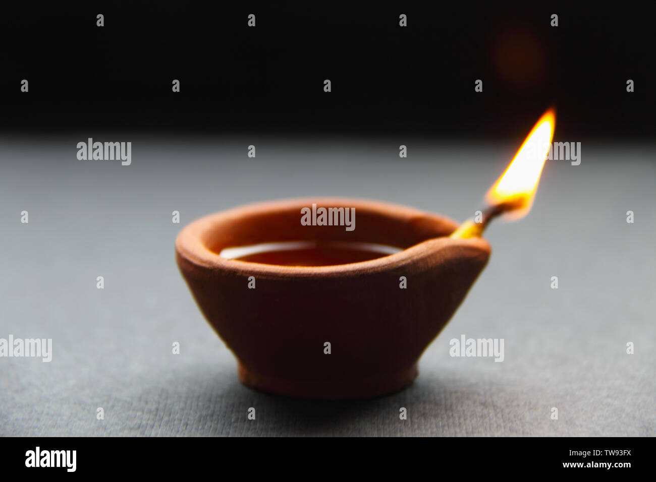 Close up of a burning oil lamp Stock Photo - Alamy
