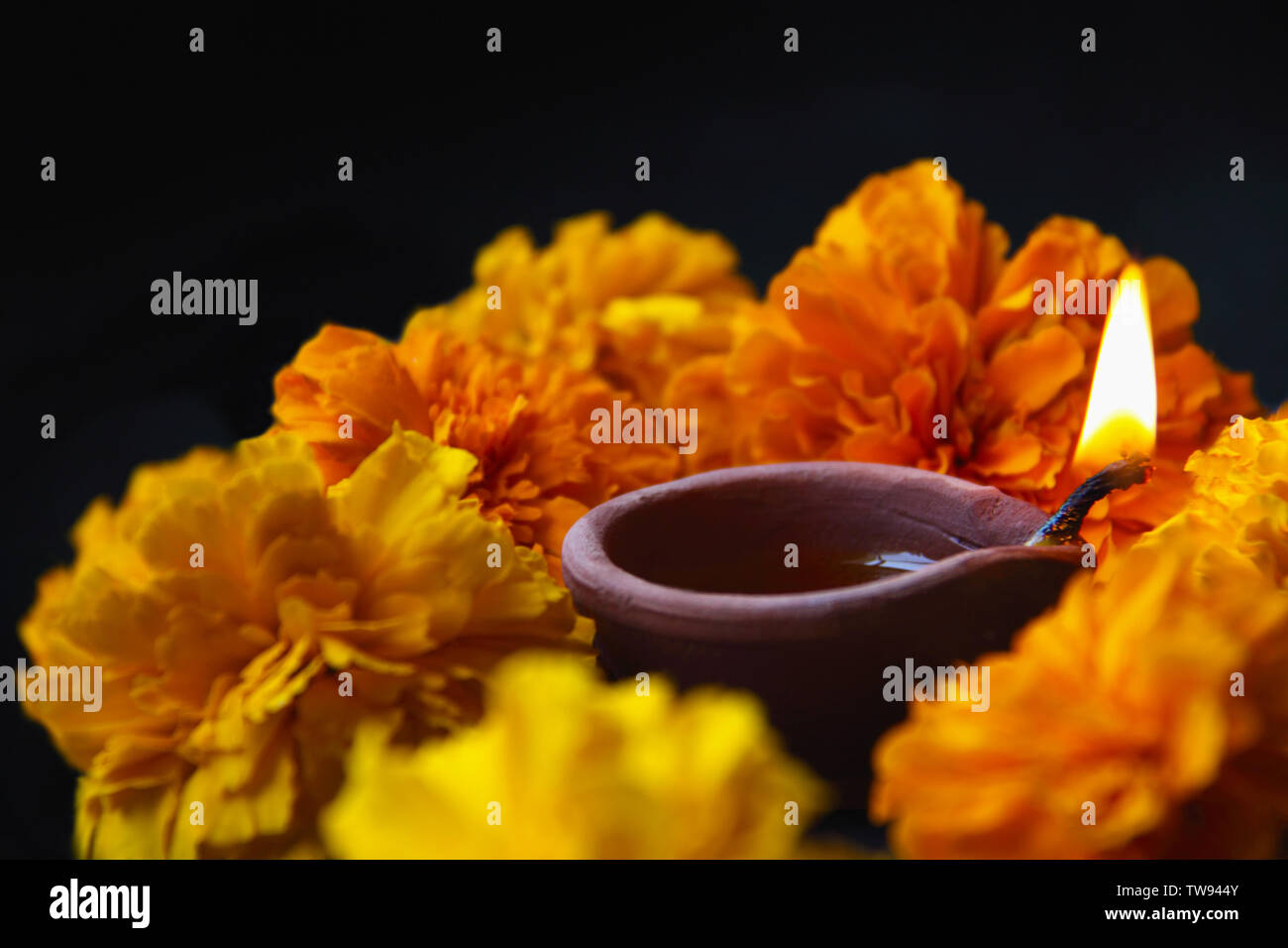 Close up of a burning oil lamp Stock Photo - Alamy