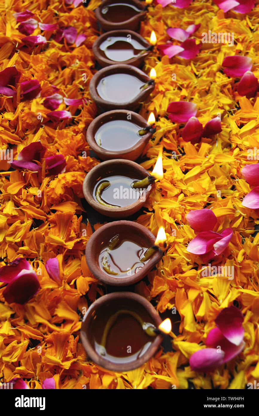 Diwali diyas burning in a row Stock Photo - Alamy