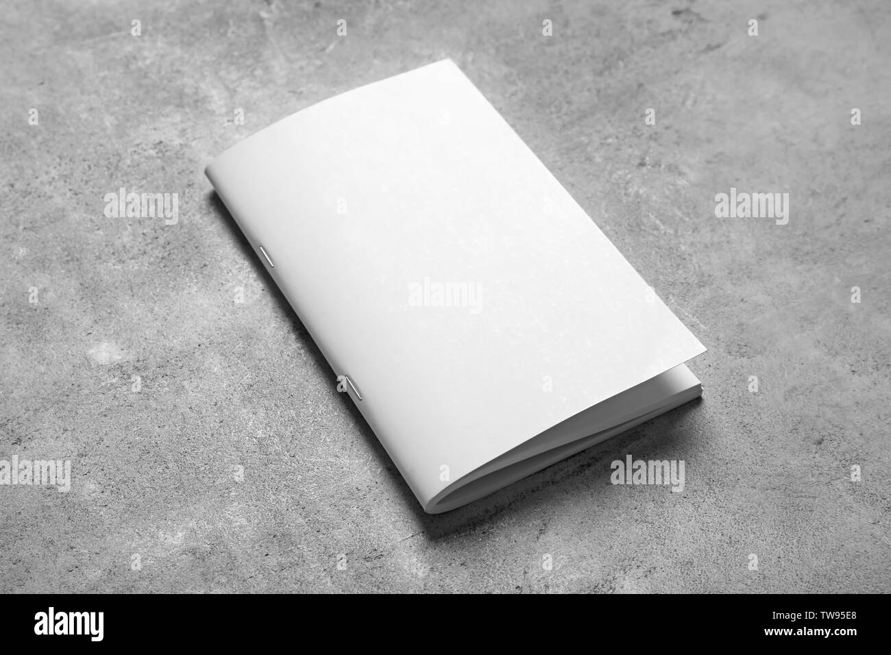 Blank booklet on grey background. Mock up for design Stock Photo - Alamy